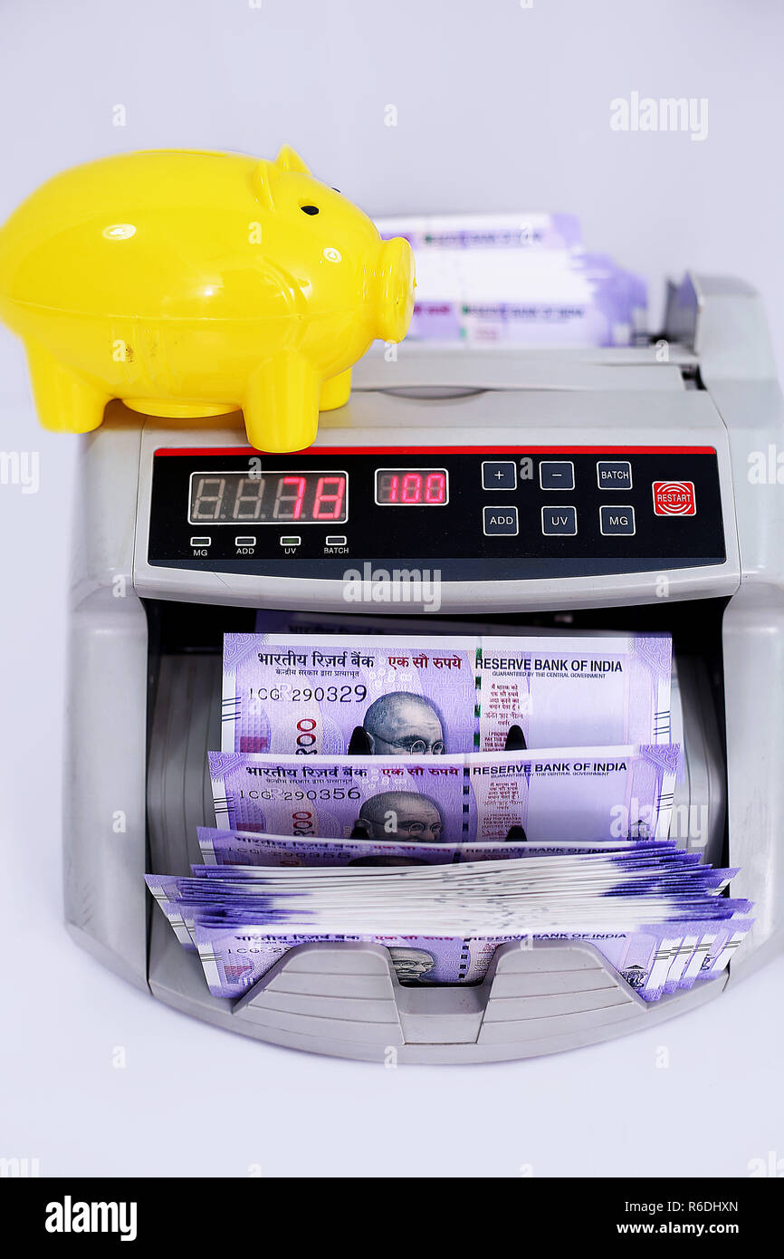 Indian banknotes one hundred rupees at the currency counter machine ...