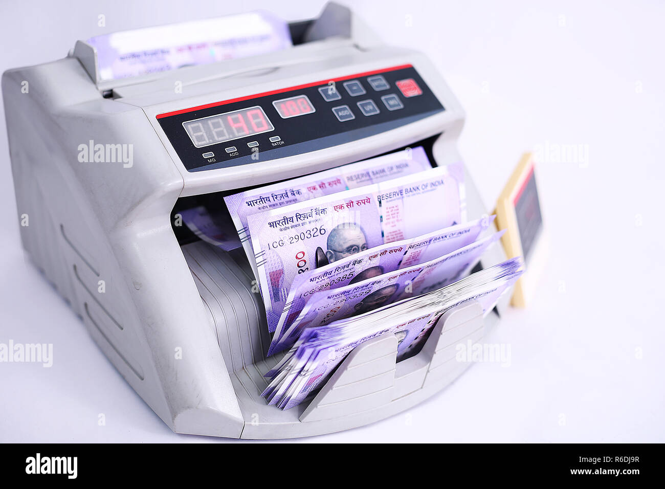 Counting currency in the money counting machine. Isolated on the white ...