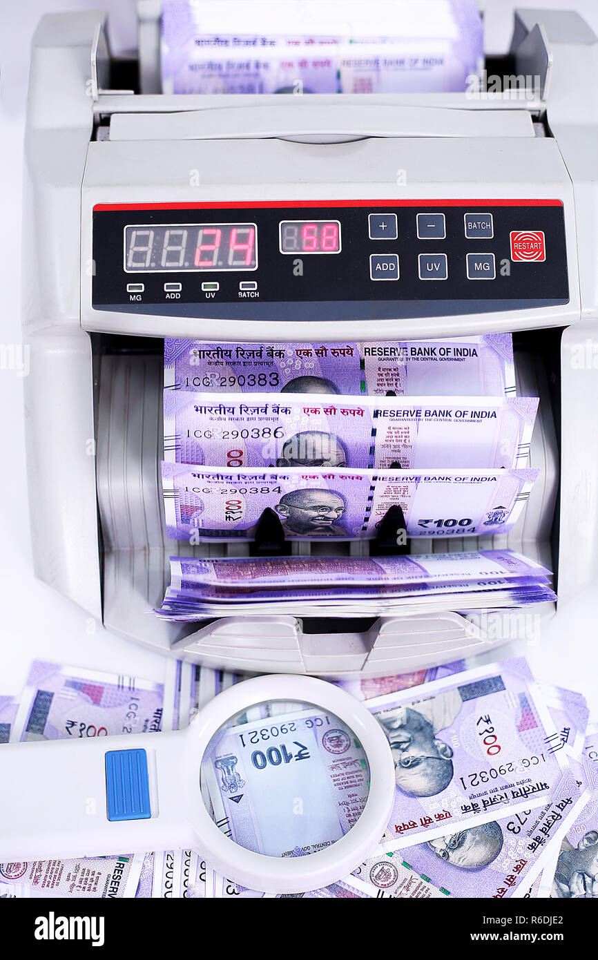 Money counting machine for counting new Indian currency. Picture of ...