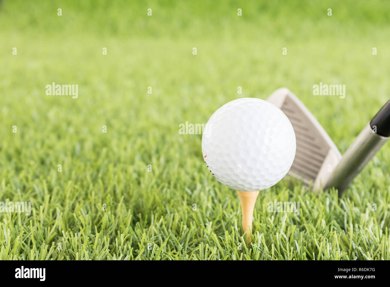 Golf ball on tee Stock Photo - Alamy