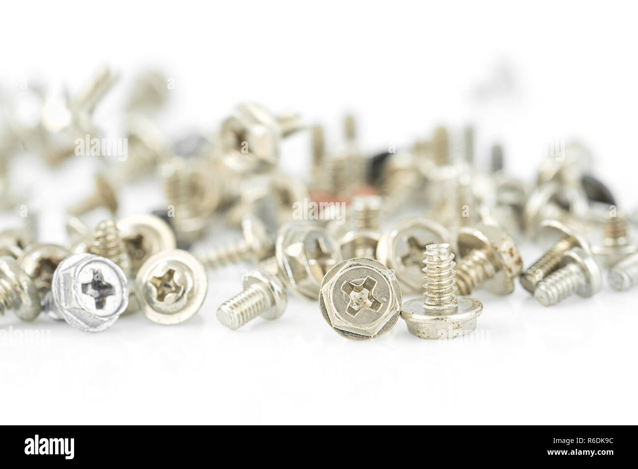 Old screws on the white background Stock Photo - Alamy