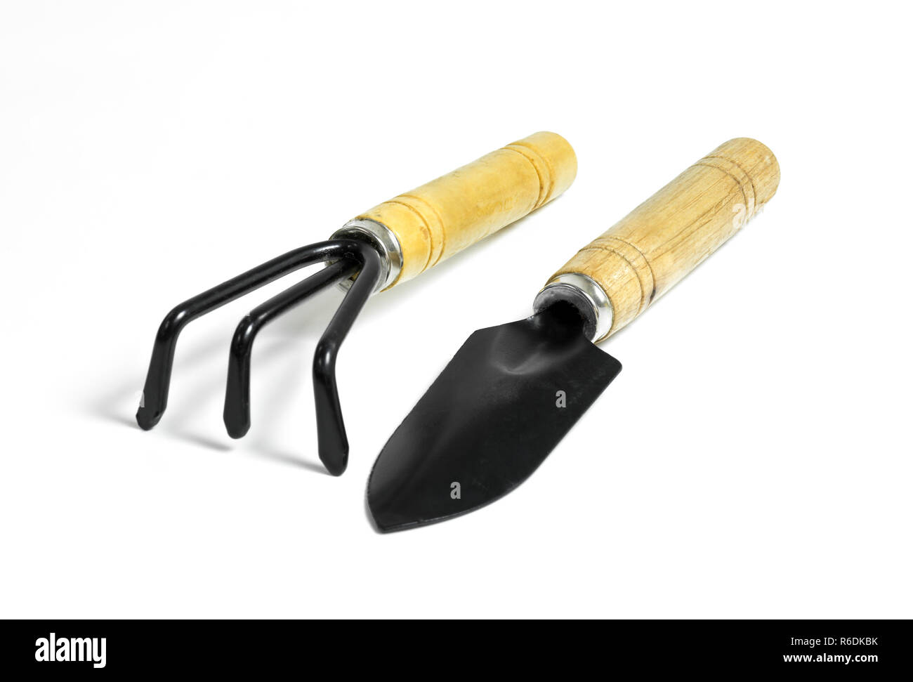 Steel rake and shovel with a wooden handle Stock Photo - Alamy