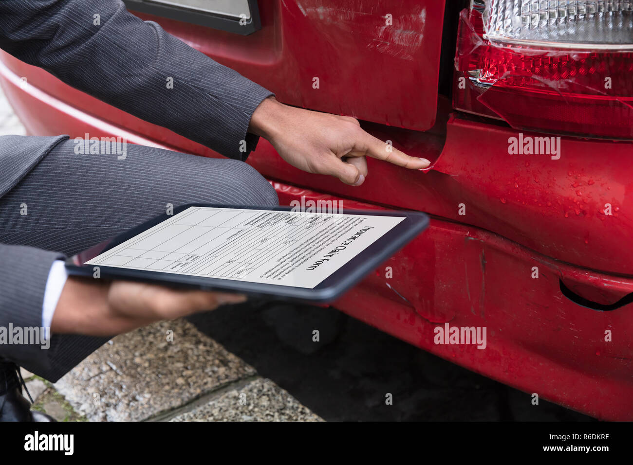 Insurance Agent Filling Insurance Claim Form On Digital Tablet Stock ...