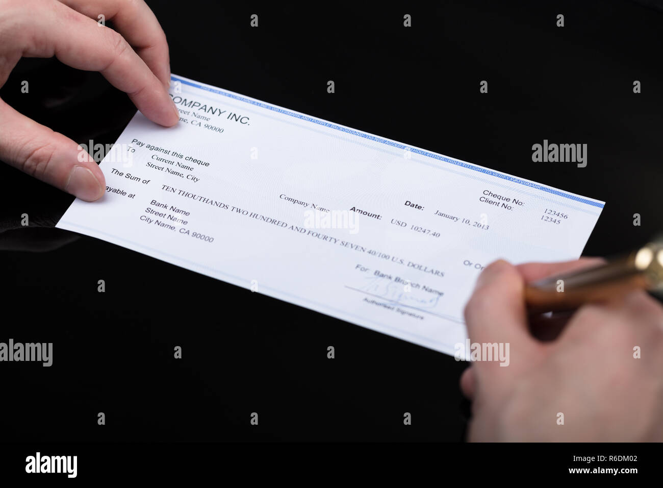 Cashier bank cheque hi-res stock photography and images - Alamy
