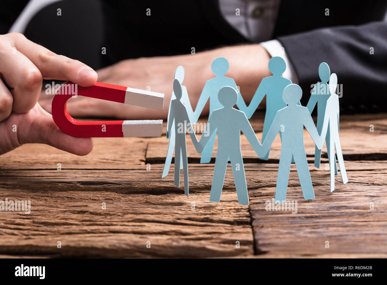 Hand horseshoe magnet attract hi-res stock photography and images - Alamy