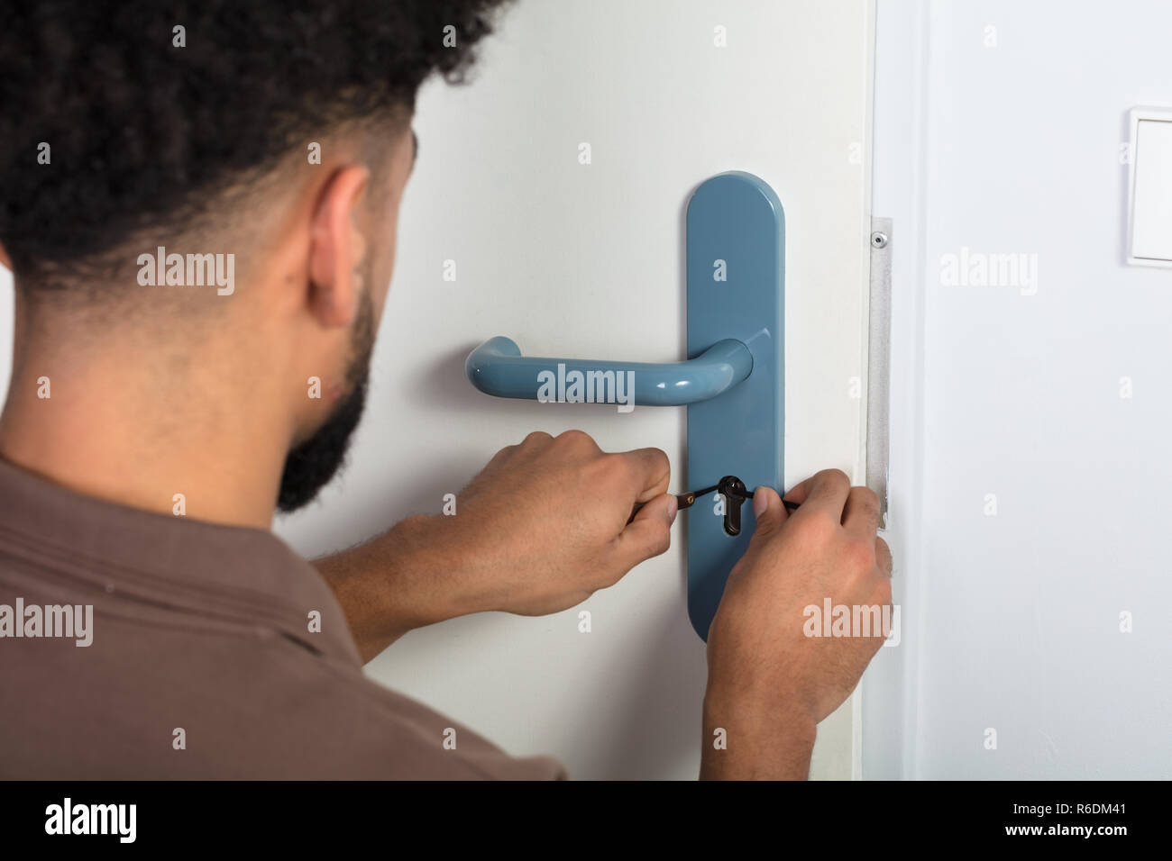 Person Opening Door Lock Stock Photo - Alamy