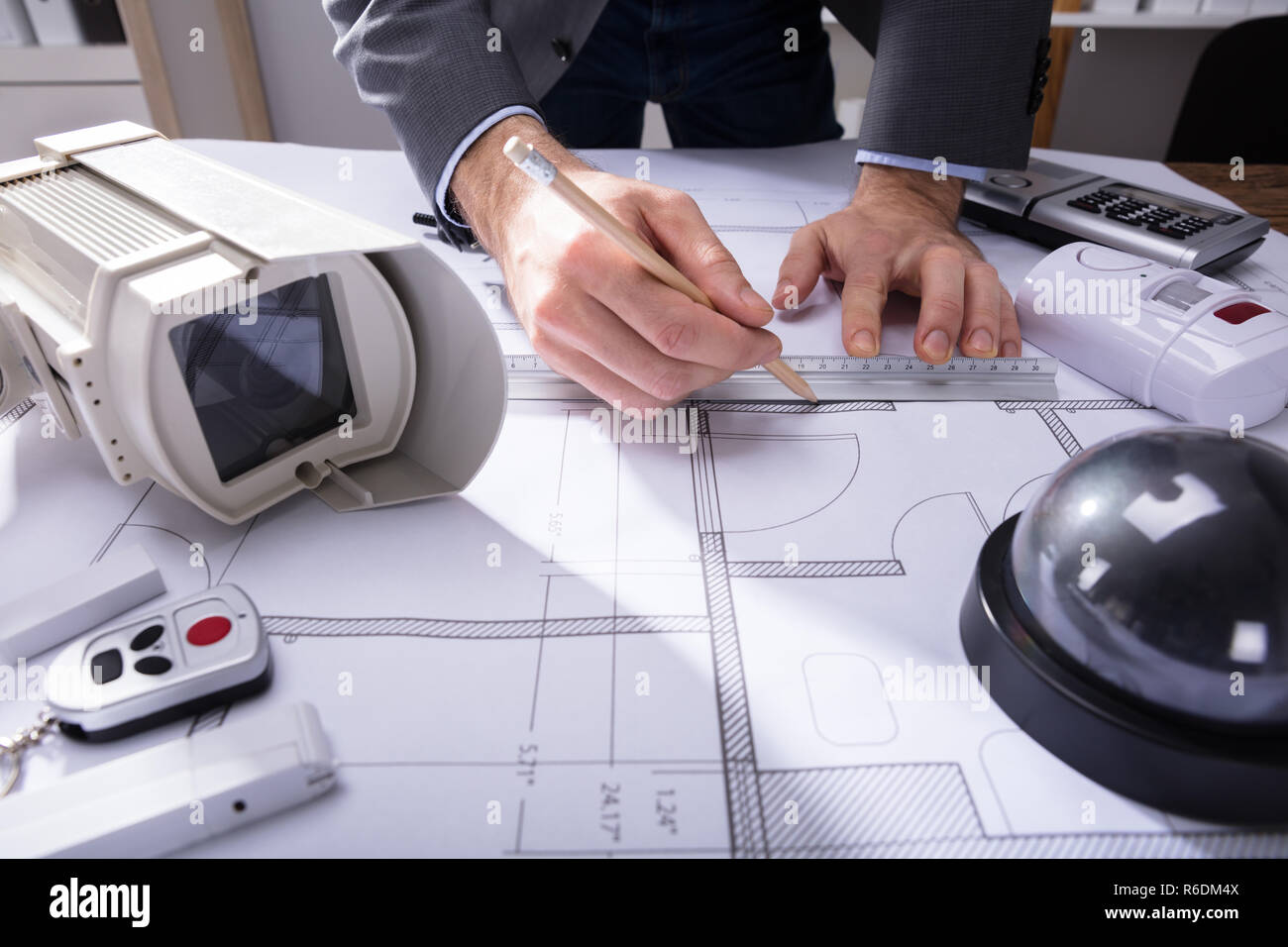 Architect Drawing Plan On Blueprint Stock Photo - Alamy
