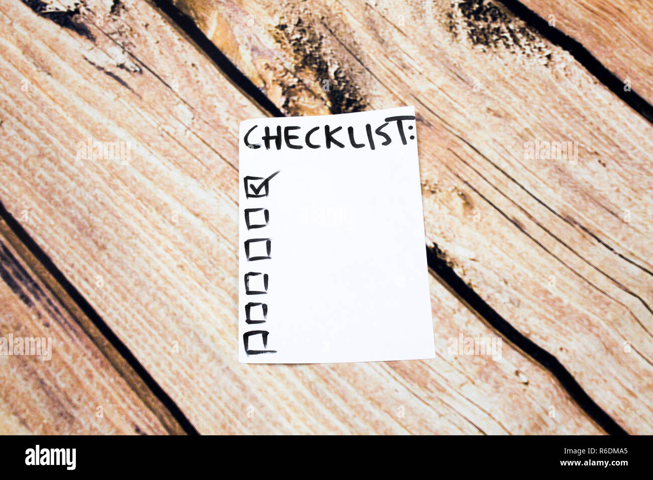 Close up of pin and to do list Checklist word on sticky note with ...