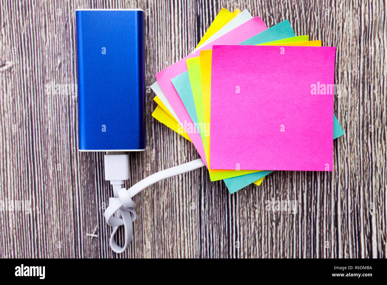 sticky note paper charging with energy bank. Depth of field on Power ...