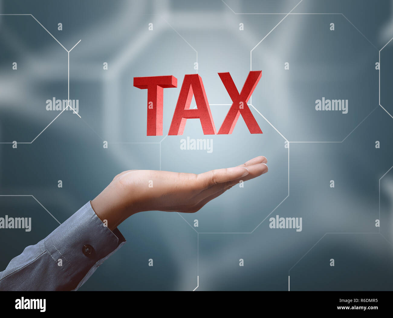 Businessman hand showing tax text Stock Photo - Alamy