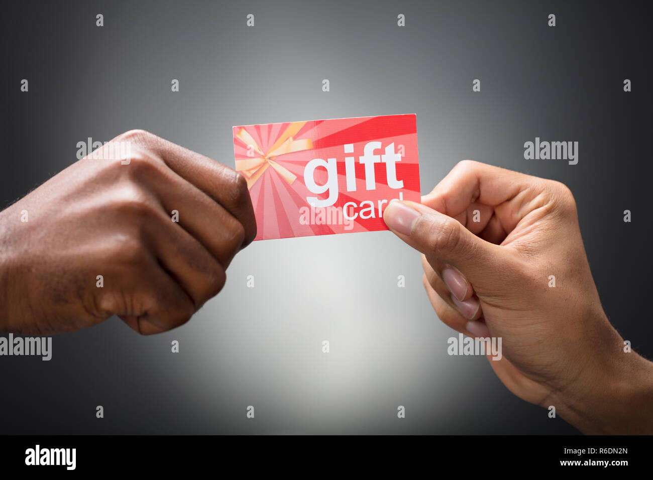 Two Hands Holding Gift Card Stock Photo - Alamy