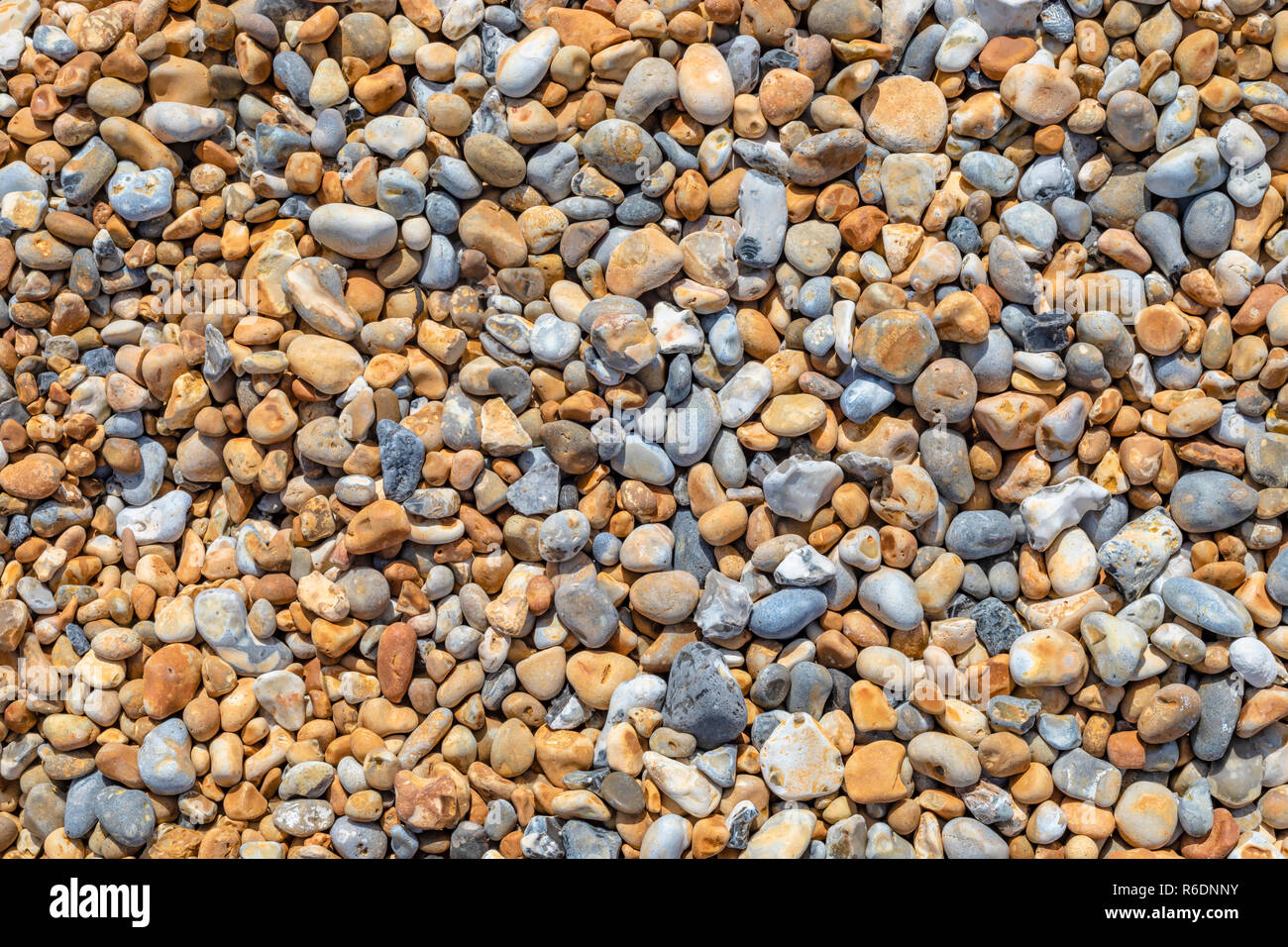 Background shot of orange, blue and white pebble stones Stock Photo - Alamy