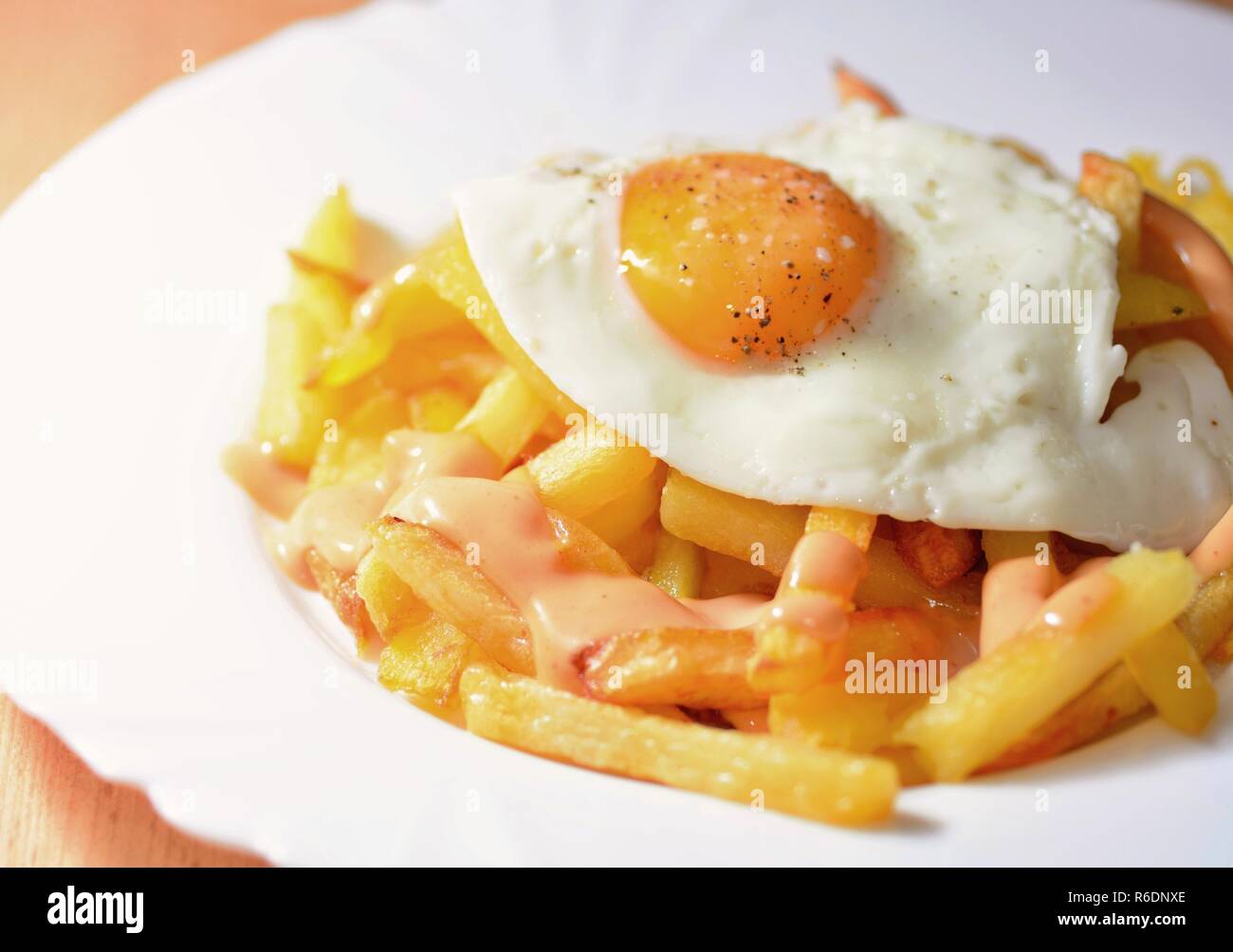 French Fries with Fried Egg Stock Photo - Alamy