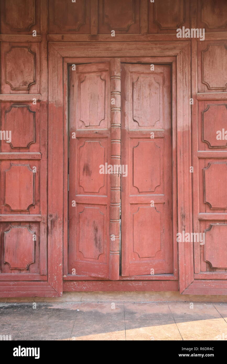 Close up of a door with carved decorations inside Mandalay Royal palace ...
