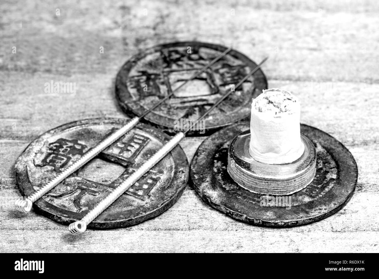 Acupuncture needles antique chinese coin Black and White Stock Photos ...