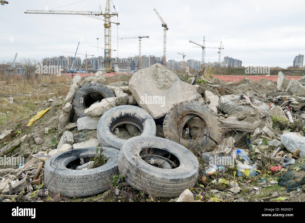 Urban housing construction.There is a lot of dirt and waste around ...