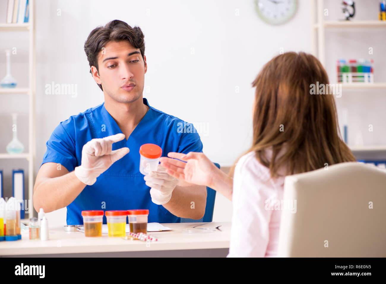 Patient visiting doctor for urine test Stock Photo - Alamy