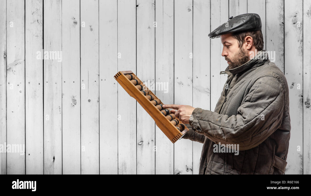 Idea - old-fashioned financial auditor with old wooden abacus, retro ...