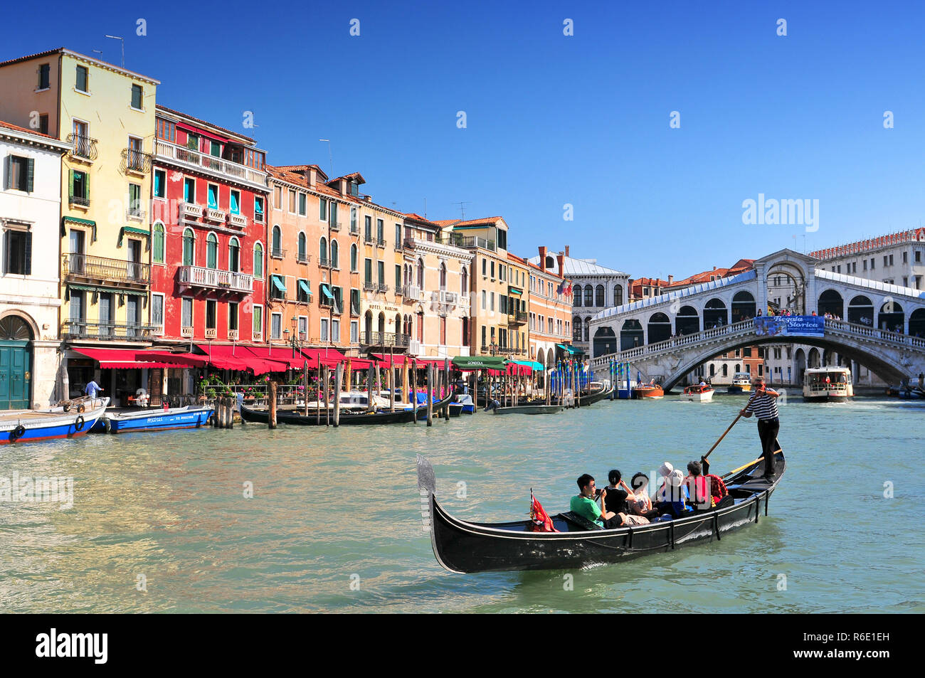 Traditional Gondolas On Canal Grande At Famous Rialto Bridge Venice