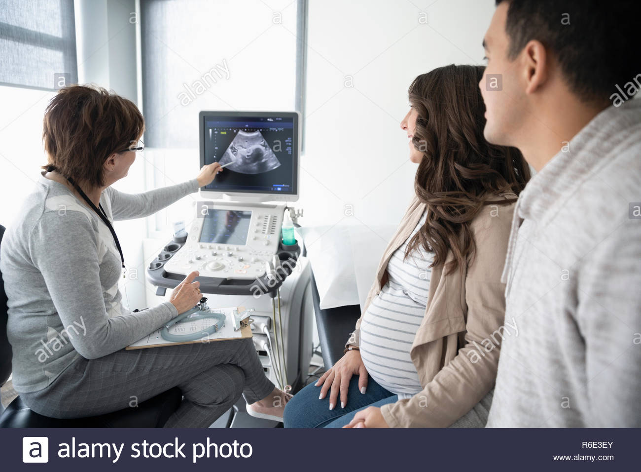 Woman showing ultrasound image hi-res stock photography and images - Alamy