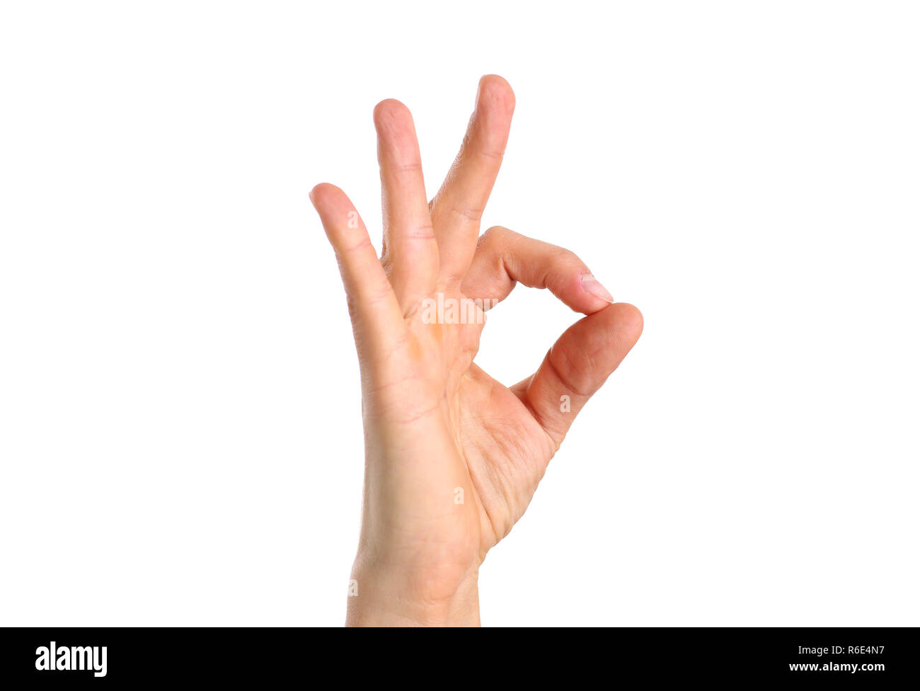 Male arm showing OK or confirm sign with thumb up Stock Photo - Alamy