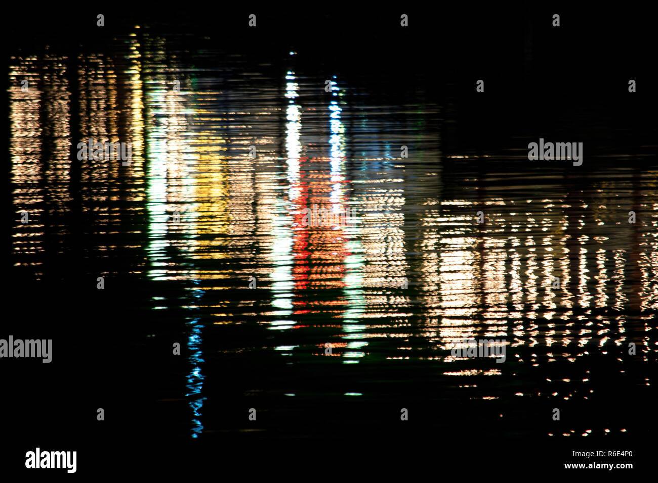 Colorful night light reflect on the water Stock Photo - Alamy