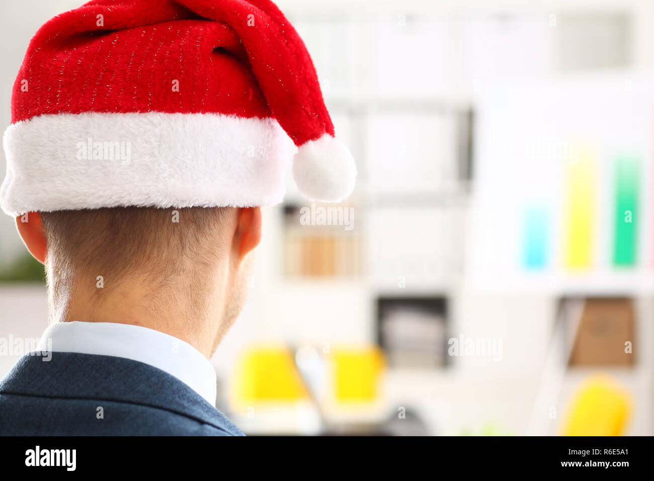 Man in suit wearing traditional red cap Stock Photo - Alamy