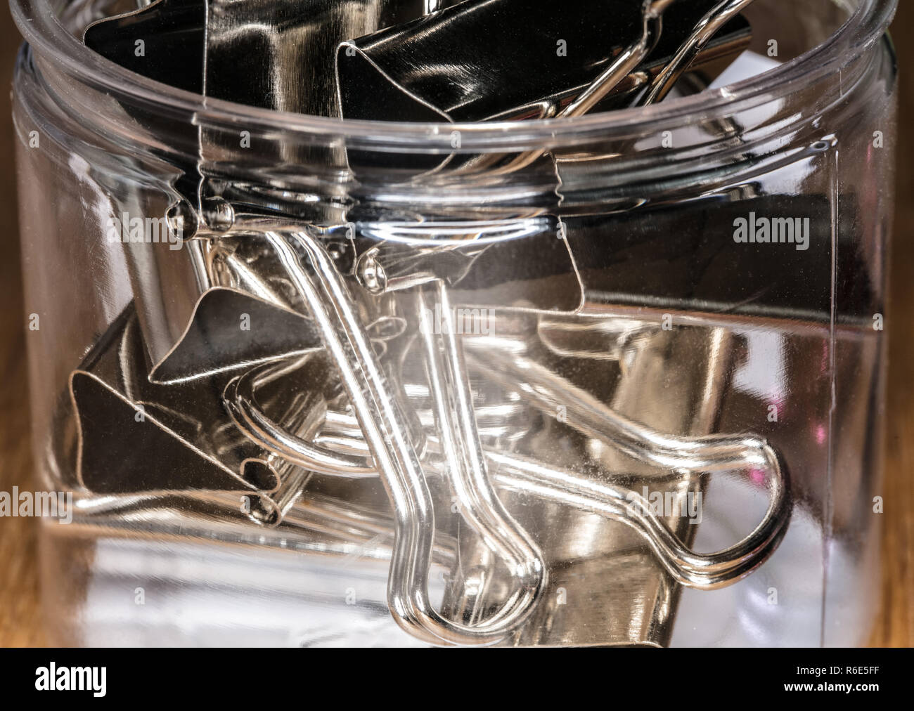 Binder Clips in clear container Stock Photo - Alamy