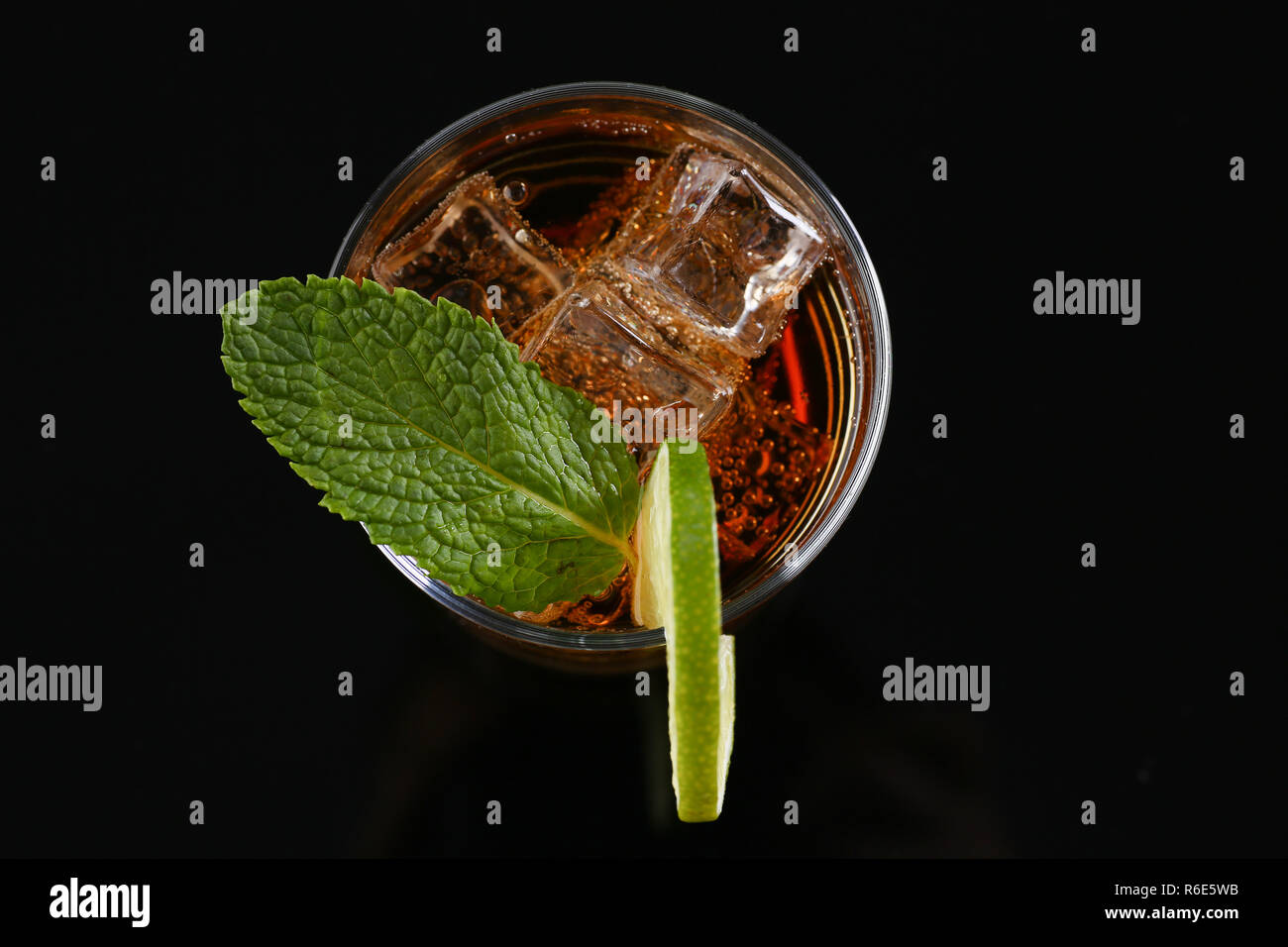 cocktail with cola and mint Stock Photo - Alamy