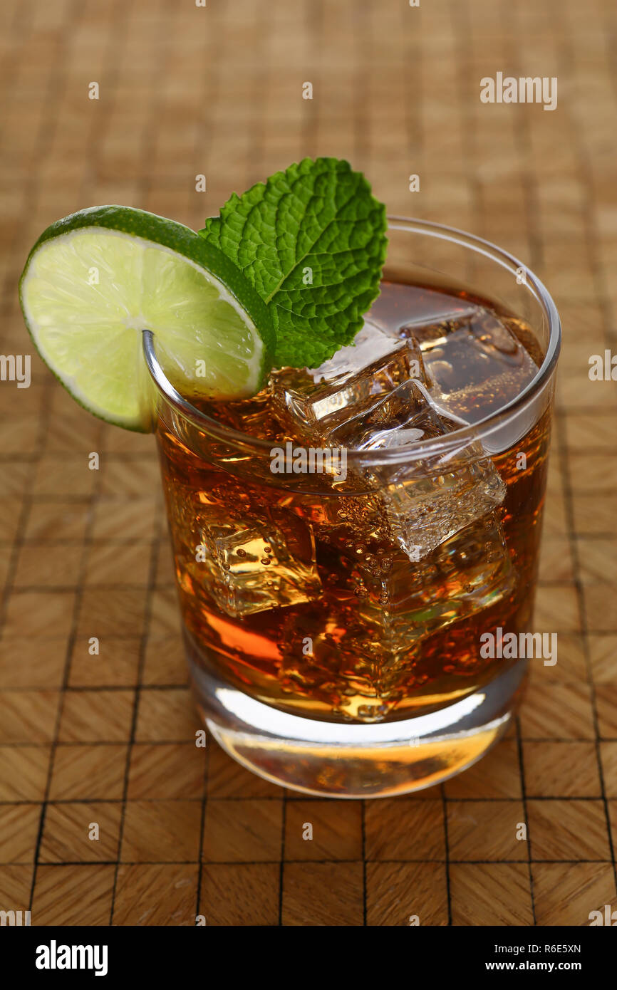 cocktail with cola and mint Stock Photo - Alamy