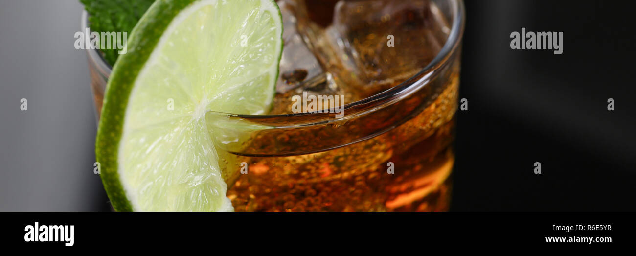 cocktail with cola and mint Stock Photo - Alamy