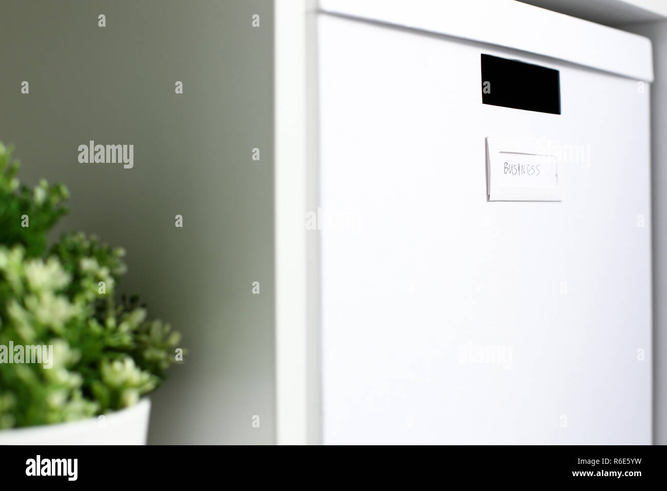 White cardboard box with business sign Stock Photo - Alamy