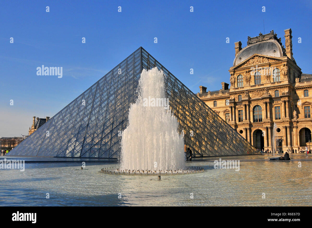 Glass Pyramid And Fountain At The Louvre Art Gallery And Museum Paris ...