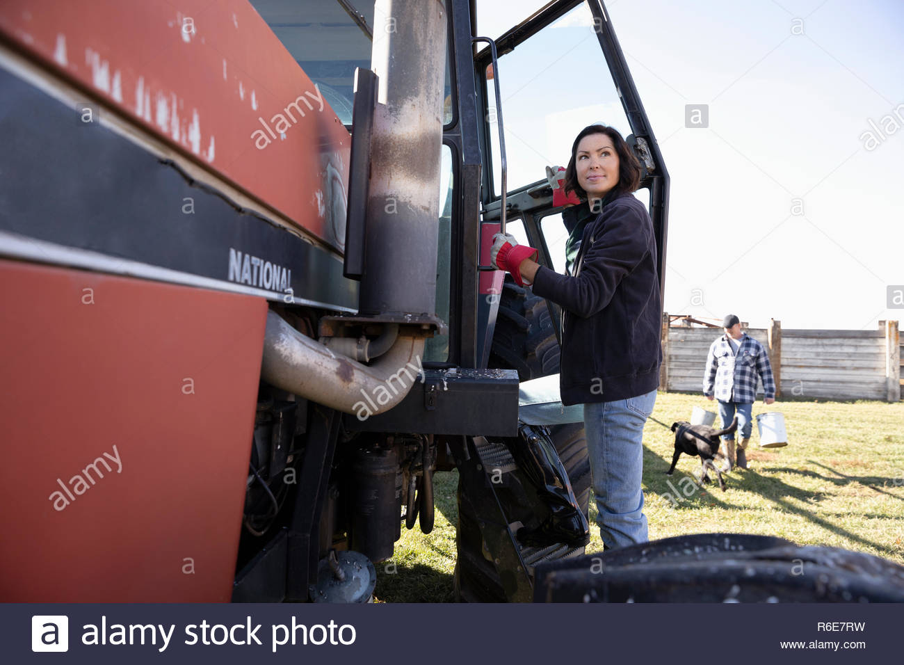 Farmer climbing tractor hi-res stock photography and images - Alamy