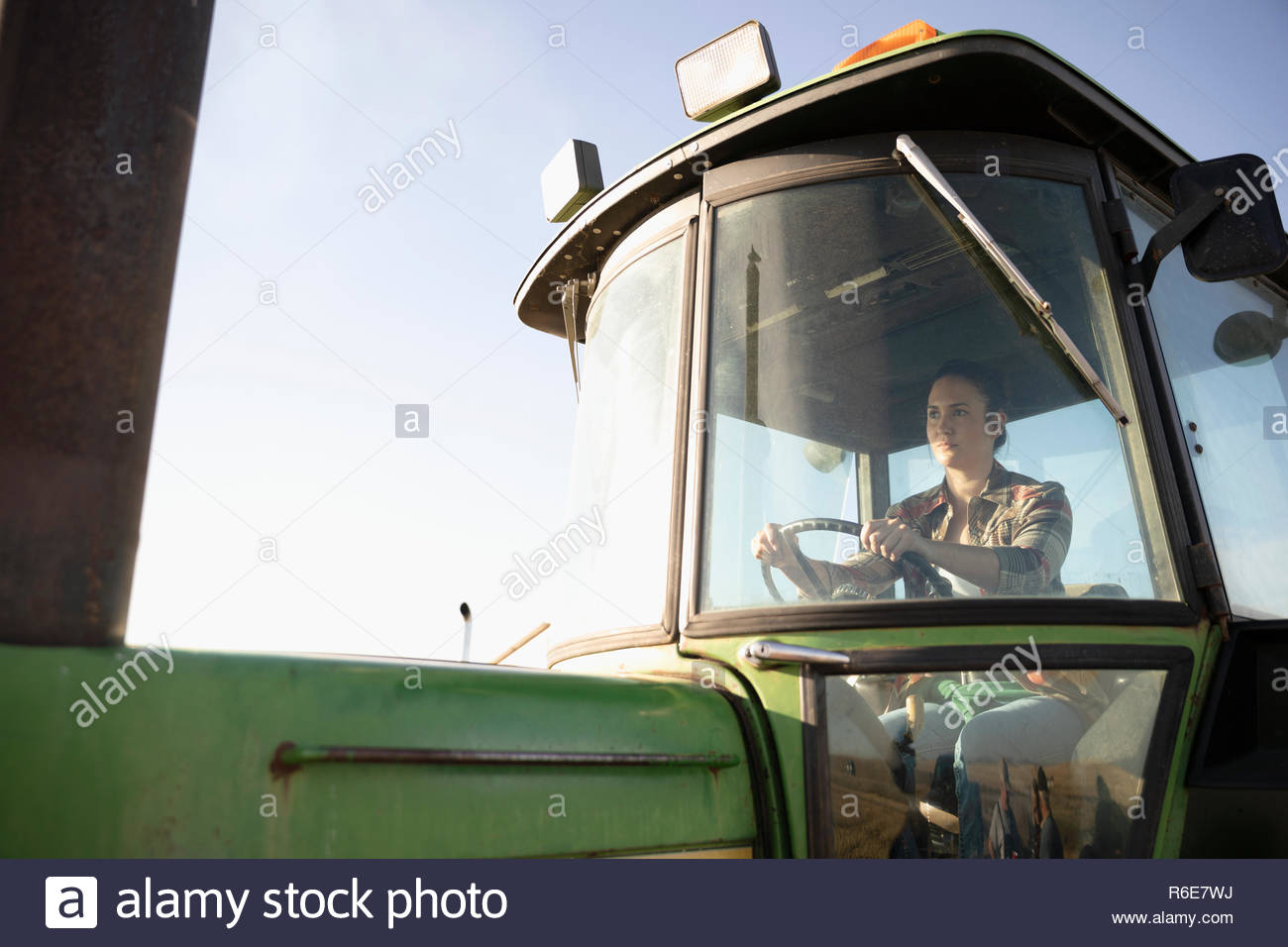 Person driving tractor hi-res stock photography and images - Alamy