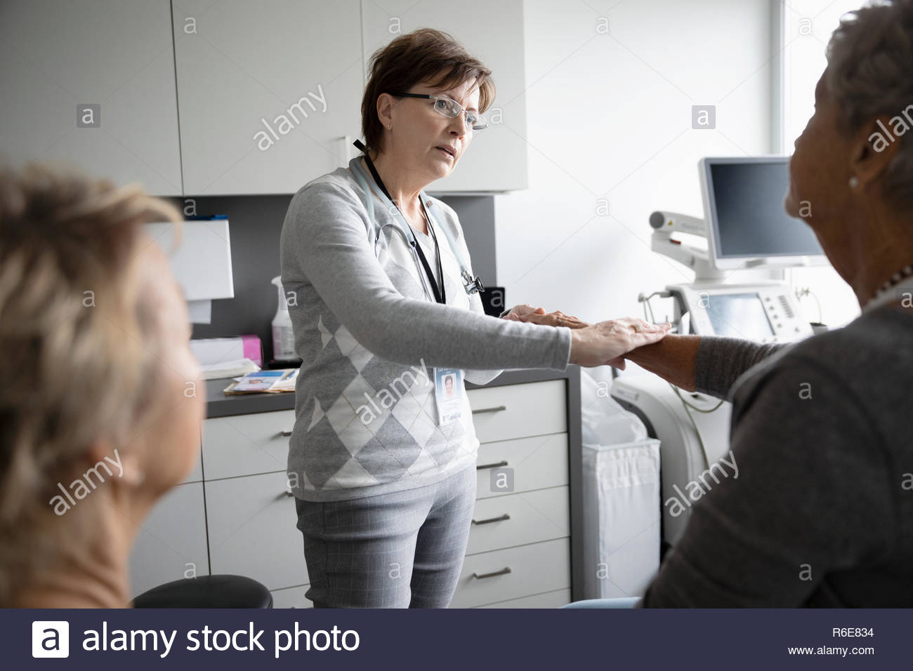 Doctor arm over shoulder hi-res stock photography and images - Alamy