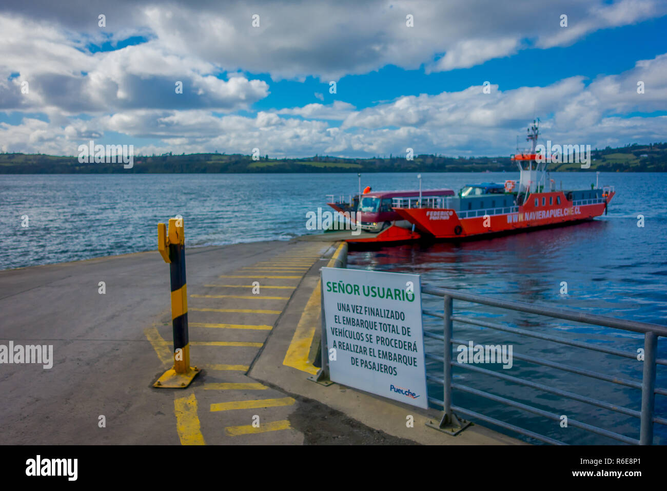 CHILOE, CHILE - SEPTEMBER, 27, 2018: Outdoor view of small red ferry ...