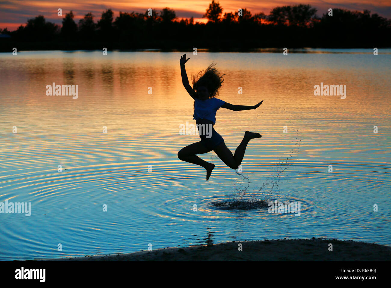 Boy girl jumping water hi-res stock photography and images - Alamy