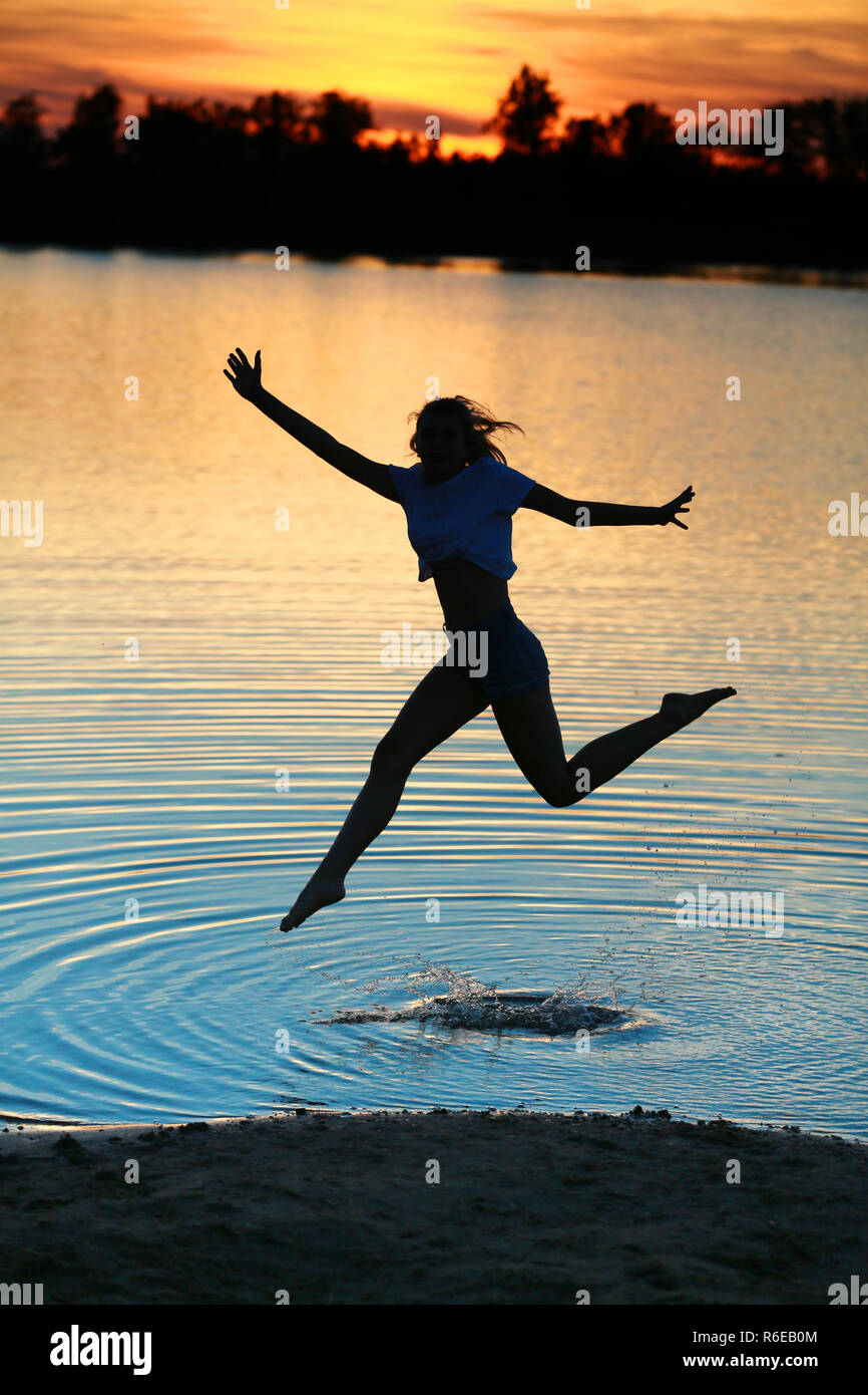 Boy girl jumping water hi-res stock photography and images - Alamy