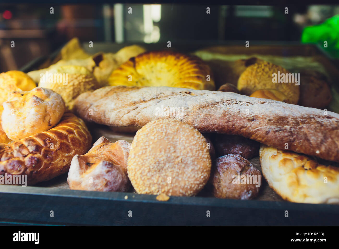 Fresh bread on shelves in a bakery Stock Photo - Alamy
