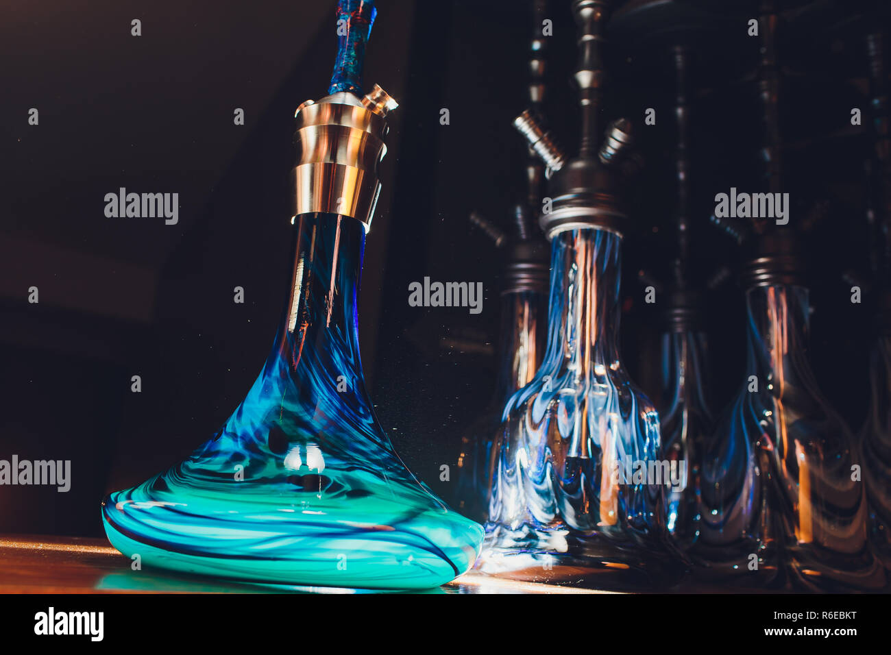 group of red hookahs shisha on table in interior Stock Photo - Alamy