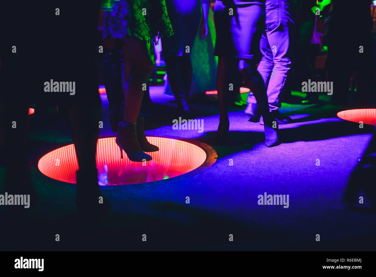 happy dancing at wedding reception. gorgeous guests and wedding couple ...