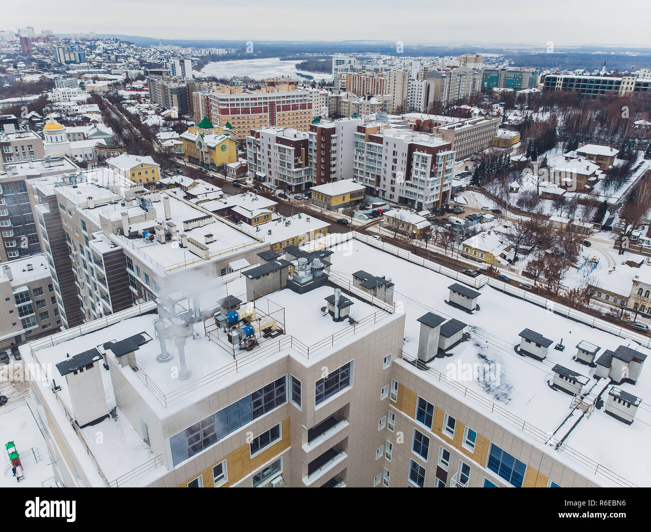 Snow covered city town and village houses in daylight with fresh snow ...
