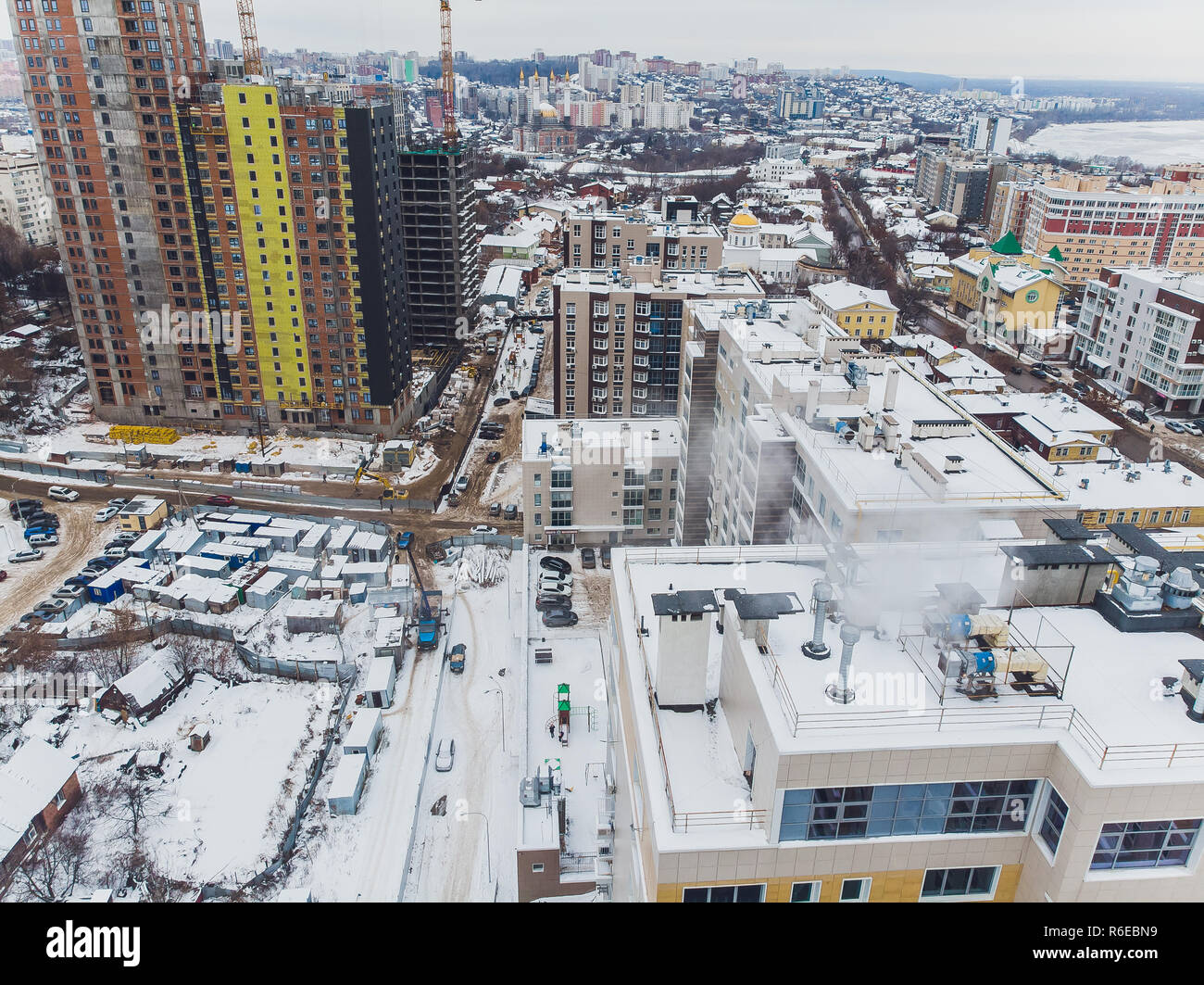 Snow covered city town and village houses in daylight with fresh snow ...