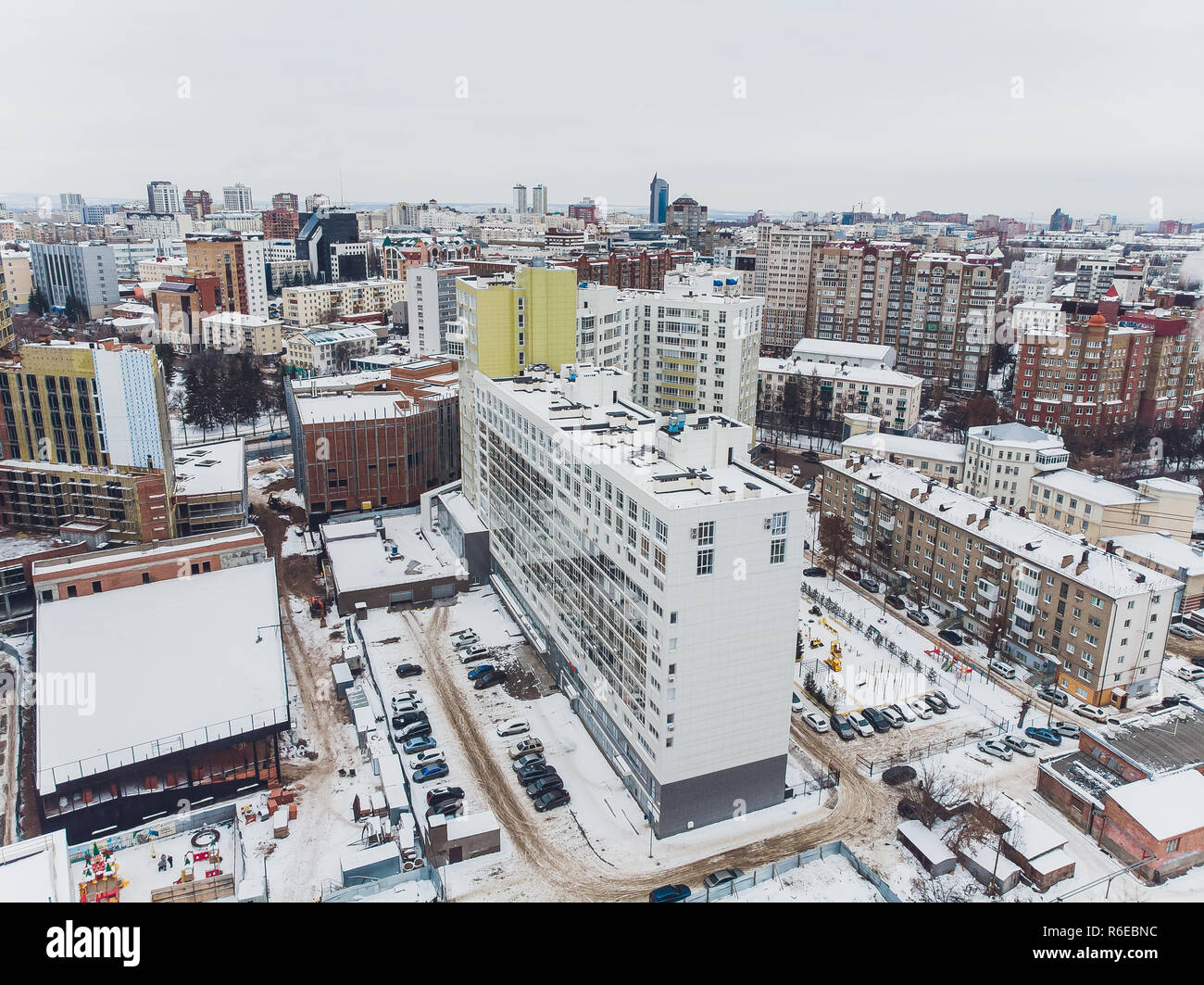 Snow covered city town and village houses in daylight with fresh snow ...