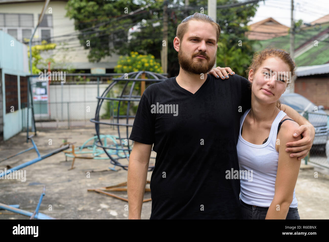 Young couple thinking together and leaning on shoulder of each o Stock ...