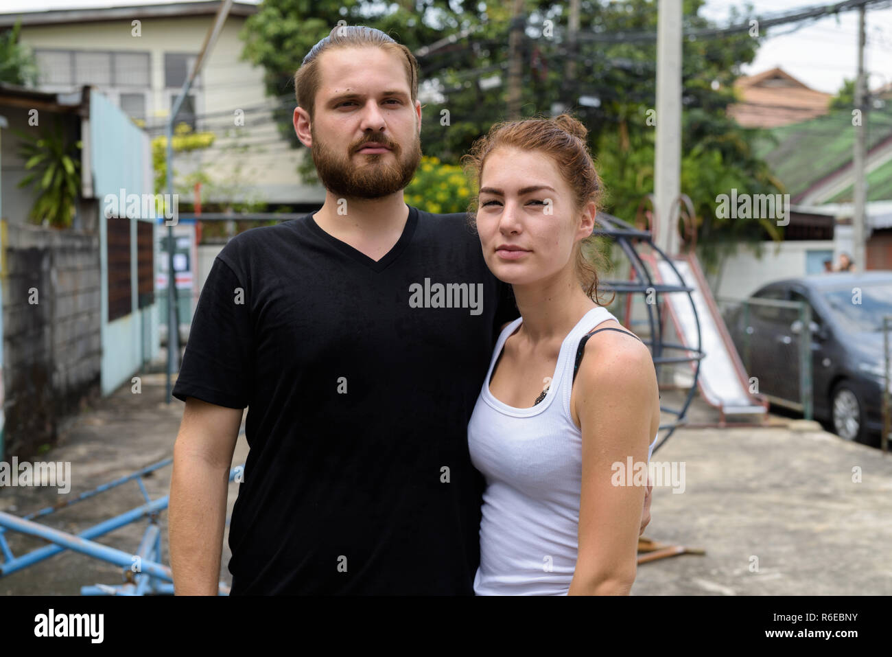 Young couple thinking while looking at distance together in the Stock ...
