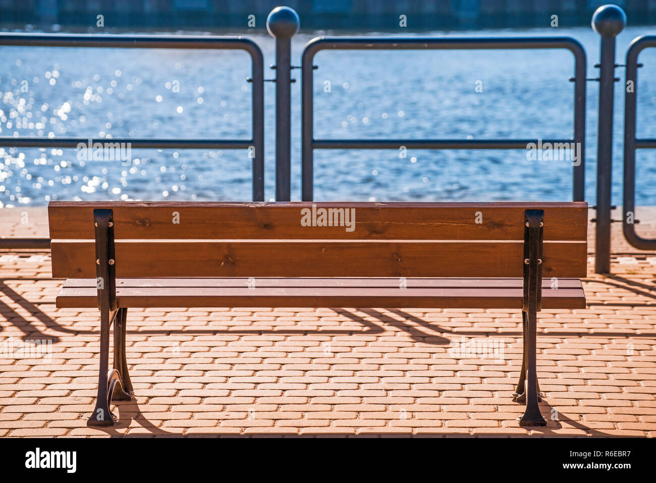Park Bench At A Seaport Stock Photo - Alamy