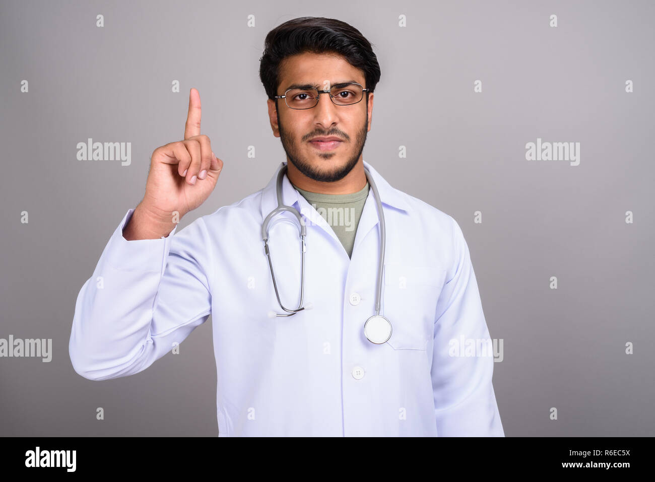 Male doctor pointing up hi-res stock photography and images - Alamy