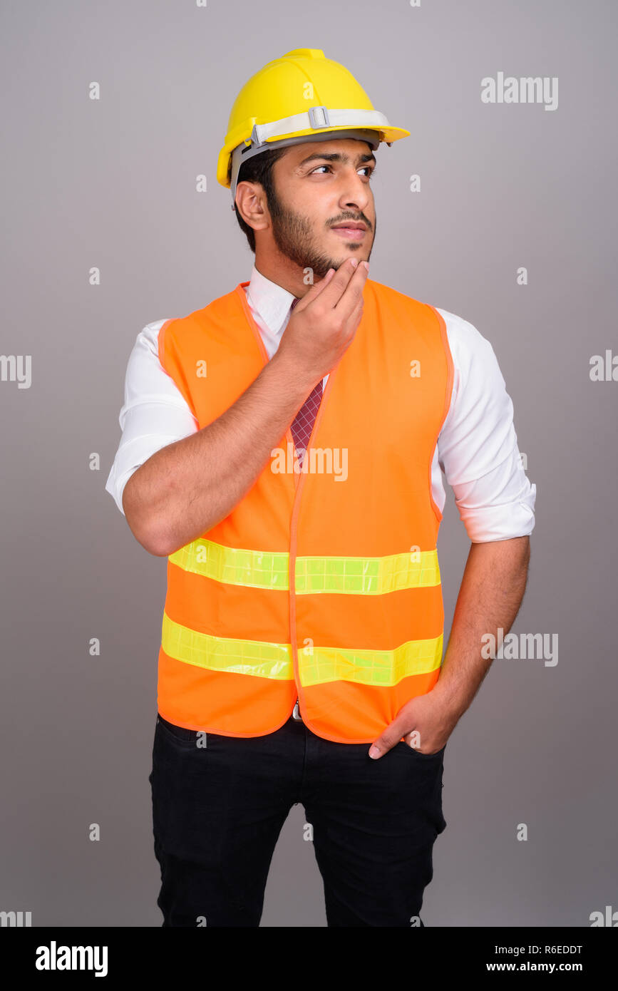 Portrait of Indian man construction worker businessman thinking Stock ...